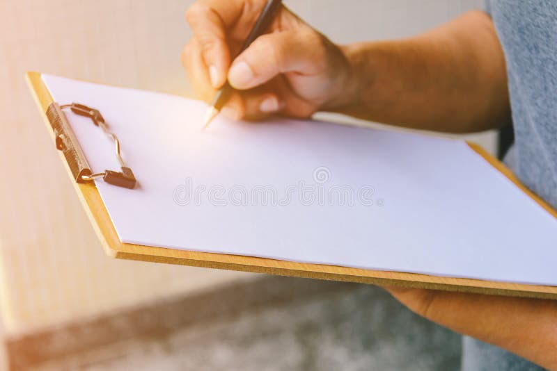 People are Writing a Message on it Paper on Clipboard Stock Image ...