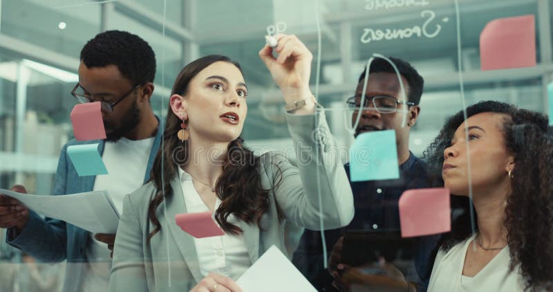 People, Writing and Notes on Glass Wall with Teamwork, Planning and ...