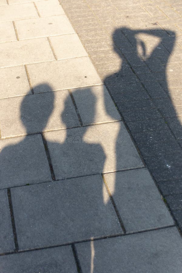 Peoples Shadows stock photo. Image of outdoors, town - 182505384