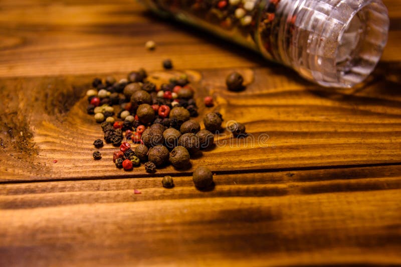 Pepper Mill and Scattered Spices on the Wooden Table Stock Photo ...