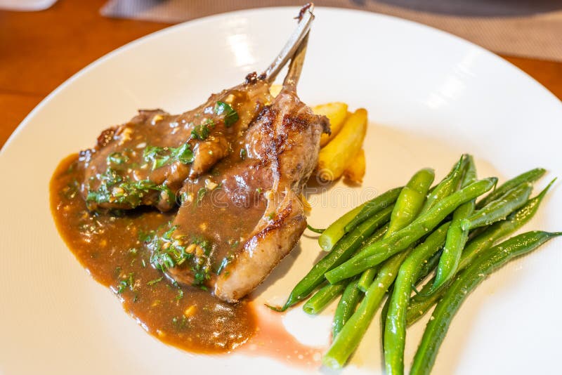 Pepper Sauce Lamb Chops with Basil and String Beans Stock Photo - Image ...