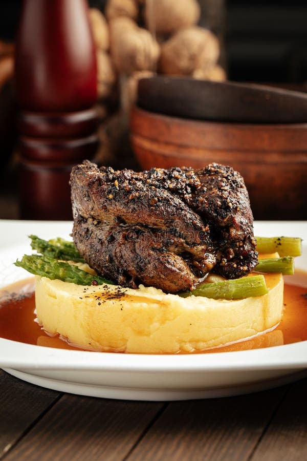 Pepper Steak with Mashed Potatoes and Asparagus Stock Photo - Image of ...