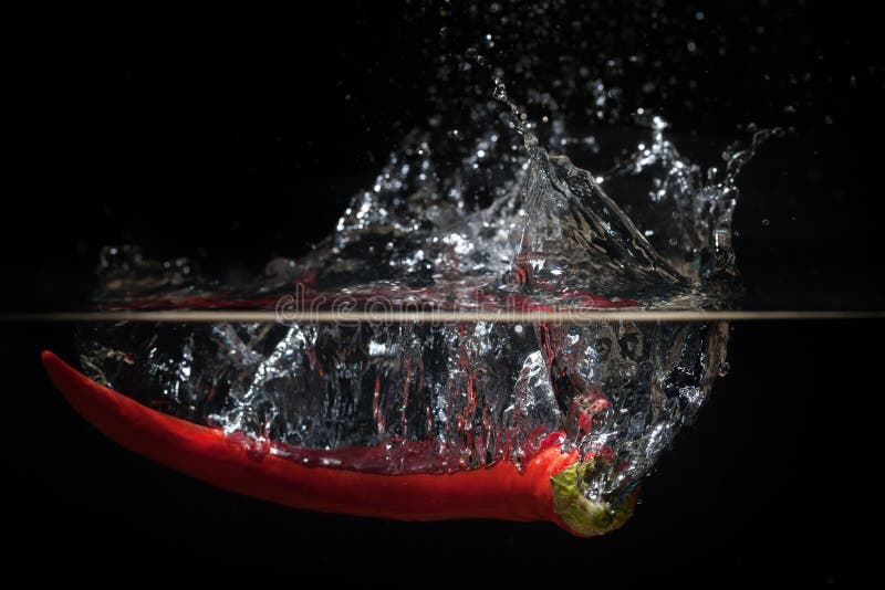 Pepper in the water stock photo. Image of drop, organic - 74144048