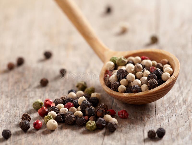 Pepper in wooden spoon stock photo. Image of food, spoon - 19681318