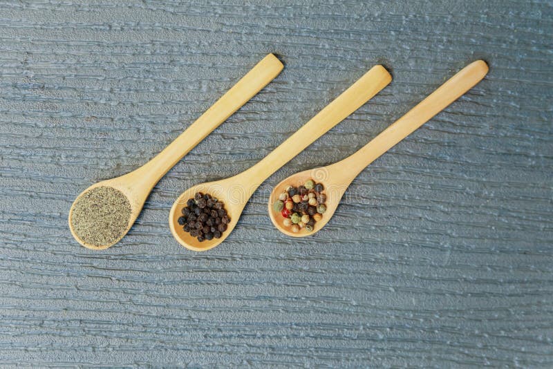 Pepper in wooden spoon stock image. Image of curry, garlic - 77786771