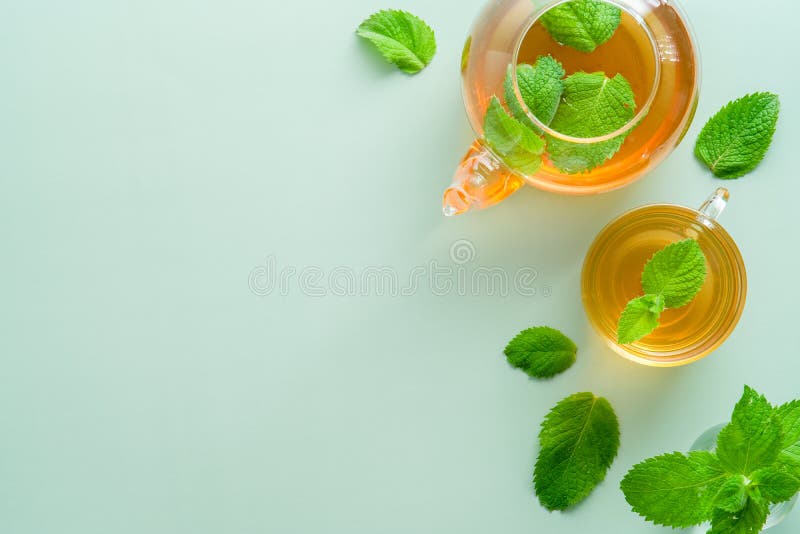 Peppermint Fresh Tea with Mint Leaves on Green Background. Flat Lay ...