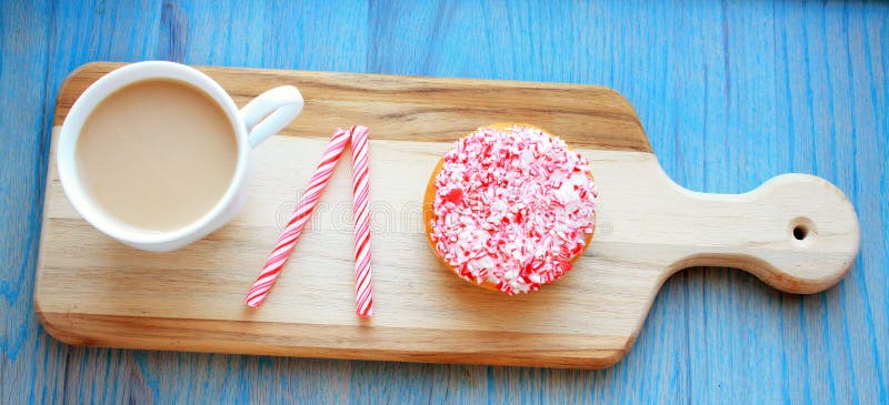 Peppermint Stick Dough Nut Next a and Mug of Coffee Stock Image - Image ...