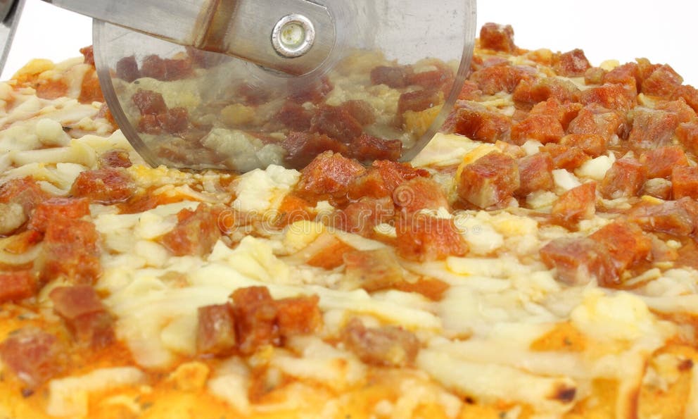 Pepperoni pizza being cut stock image. Image of cutter - 16208575