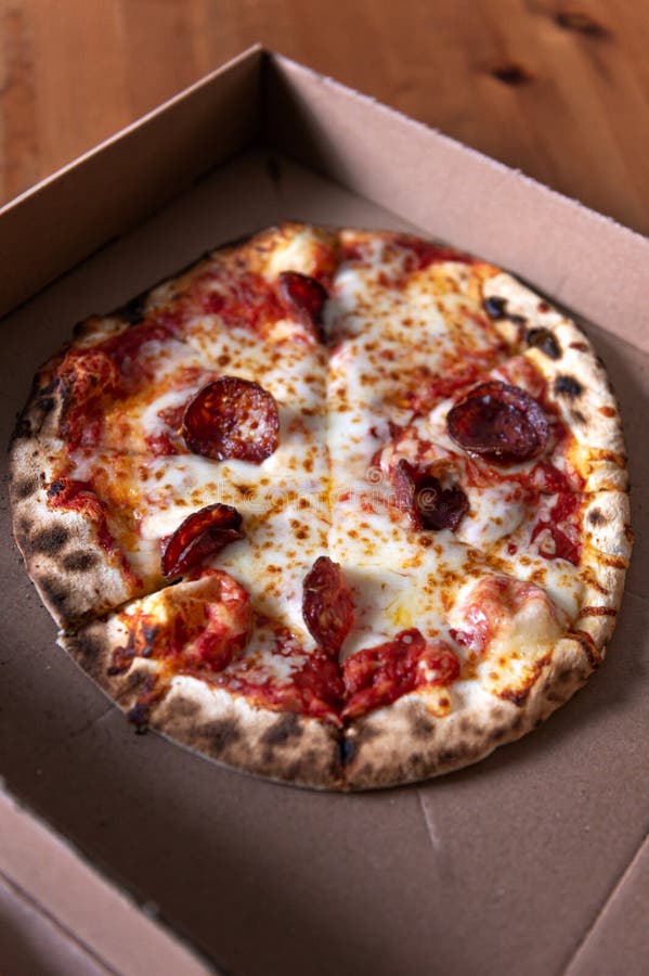 Pepperoni pizza in the box stock photo. Image of pizzeria - 241484674