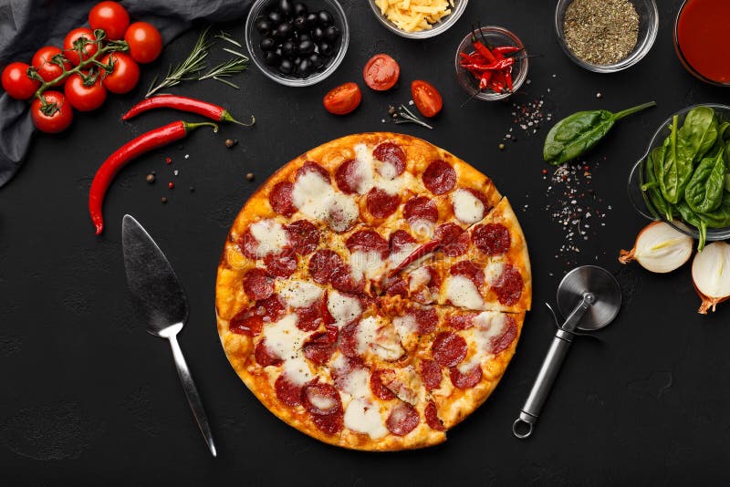 Pepperoni Pizza, Cooking Ingredients and Tools on Black Table Stock ...