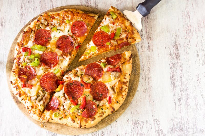 Pepperoni Pizza Slice Taken Out of Whole Pie Stock Photo - Image of ...