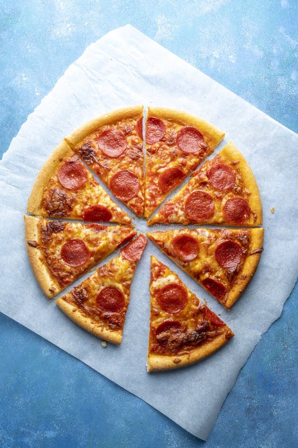 Pepperoni Pizza on Blue Background, One Pizza, Top View Stock Photo ...