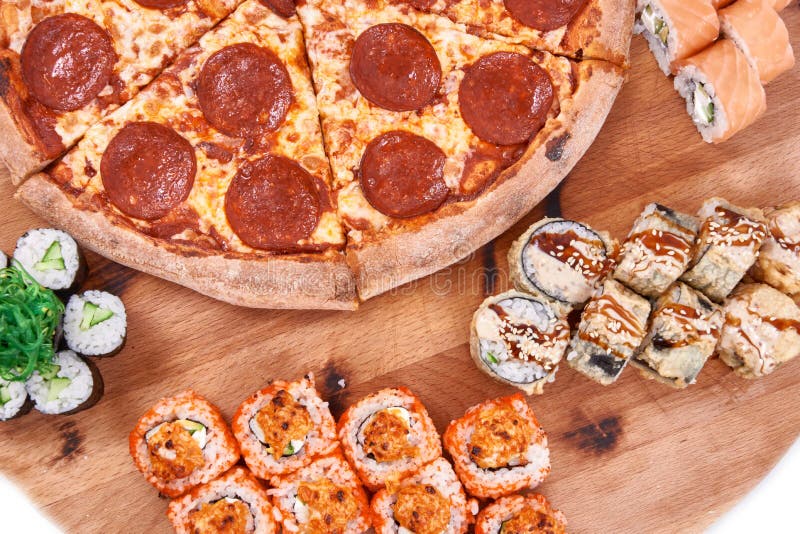 Pepperoni Pizza with Sushi Rolls Set on Wood Stock Photo - Image of ...