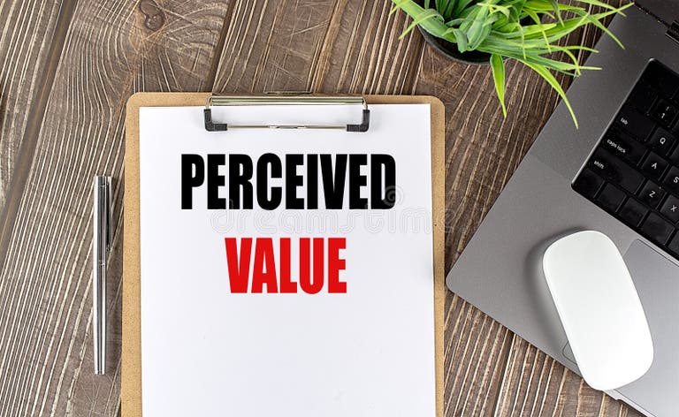 PERCEIVED VALUE Text on Clipboard Paper with Laptop, Mouse and Pen ...