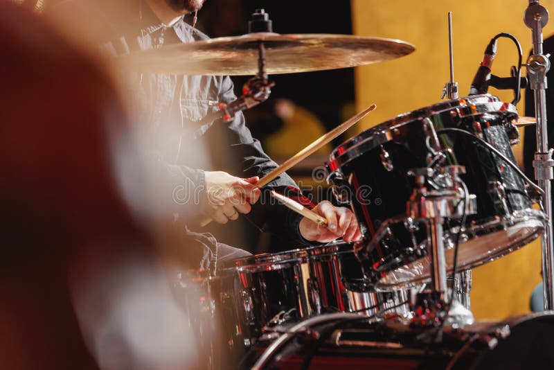 Percussionist Performing on Rock Drum Set with Drumsticks. Stock Image ...