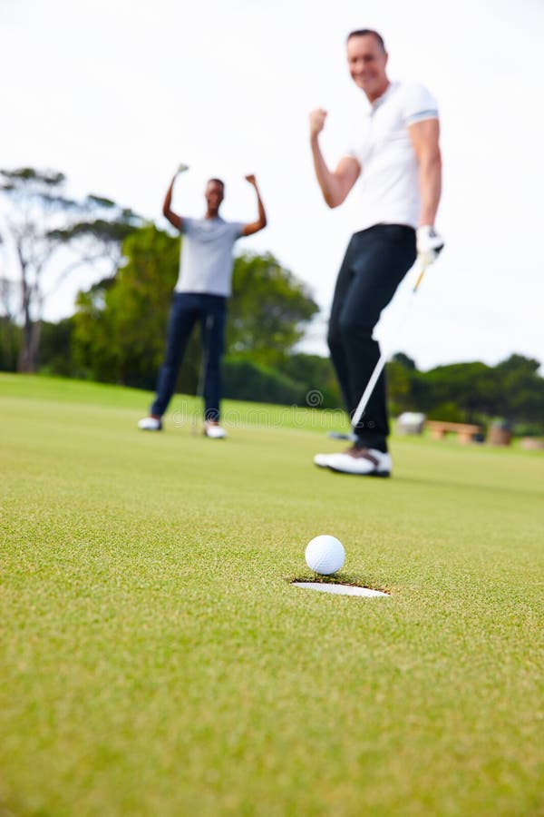 The Perfect Putt. Low Angle Shot of a Golf Ball Approaching the Hole ...