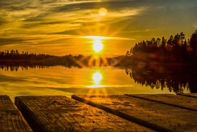 Perfect Reflection of the Sun in Water Stock Image - Image of water ...