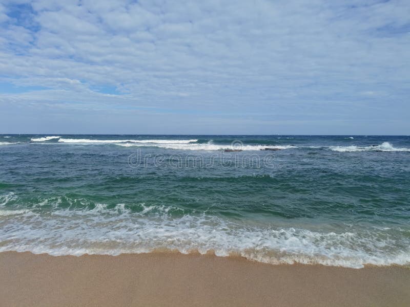 A Perfect Scene of the Azure Sea Waves, the Plain Sand and the White ...