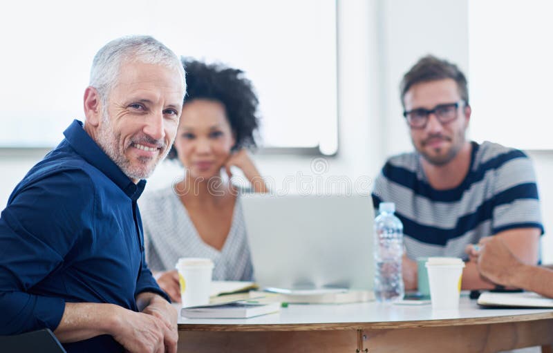 The Perfect Team. Portrait of a Group of Designers at Work in an Office ...