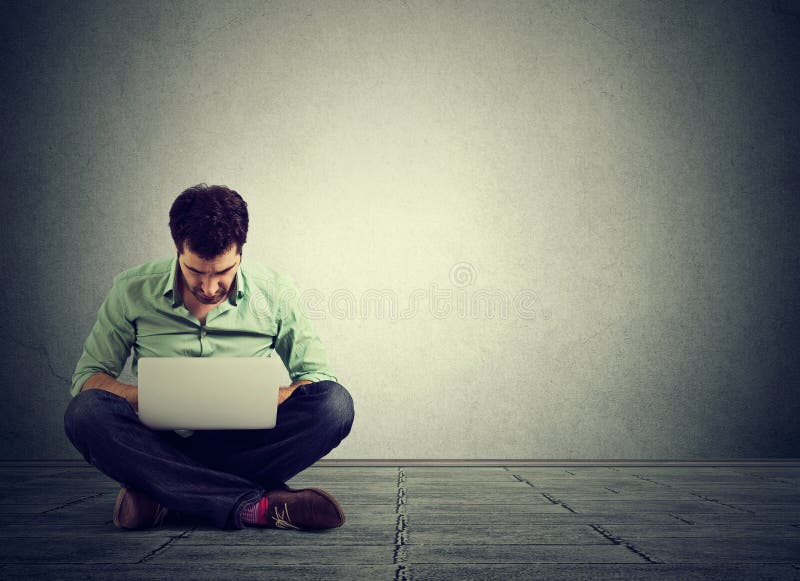 Perfect Technology. Man Sitting on Floor Working on Laptop Computer ...