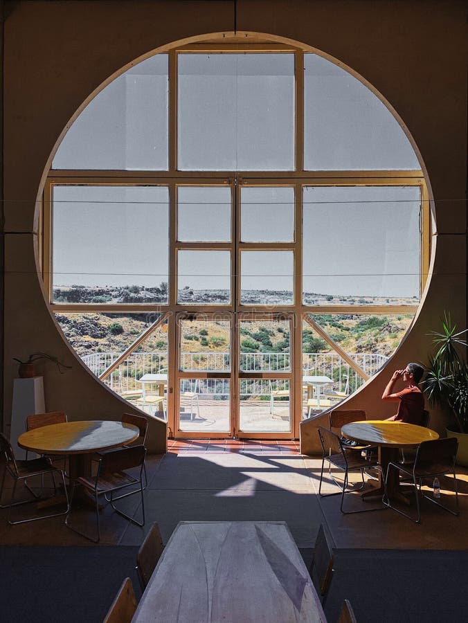 Perfect Vertical Shot of a Round Arch with Windows Overlooking Outside ...