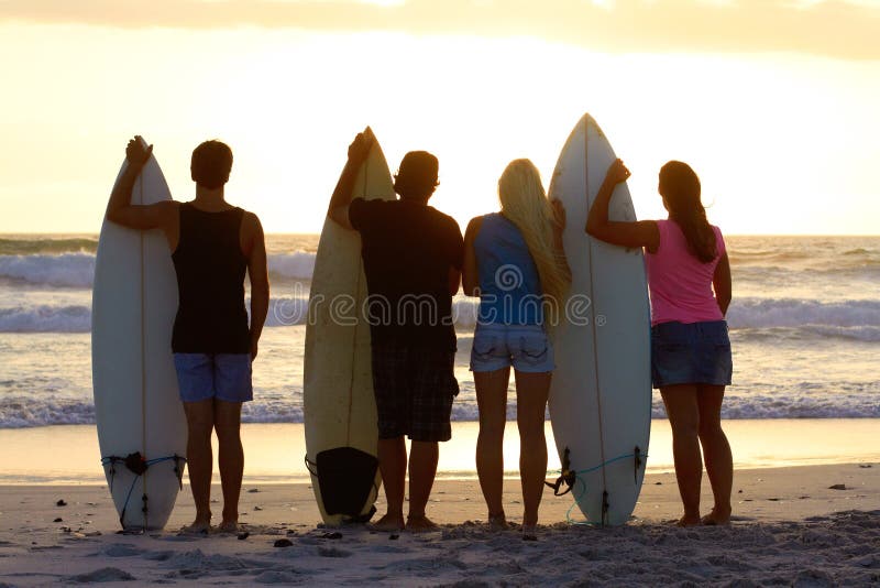 The Perfect Wave is Coming. Shot of Surfing Friends at the Beach. Stock ...