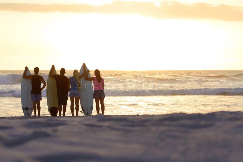 The Perfect Wave is Coming. Surfing Friends at the Beach. Stock Image ...