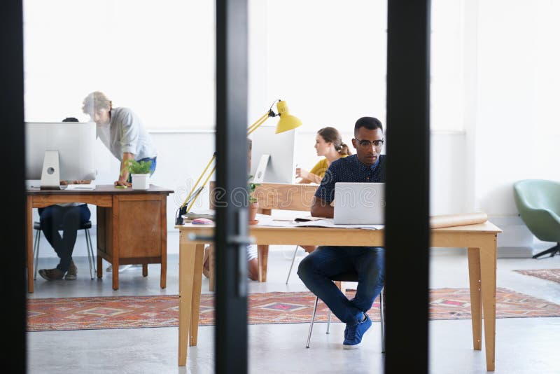Perfect Work Environment. Young Professionals Working in an Office ...
