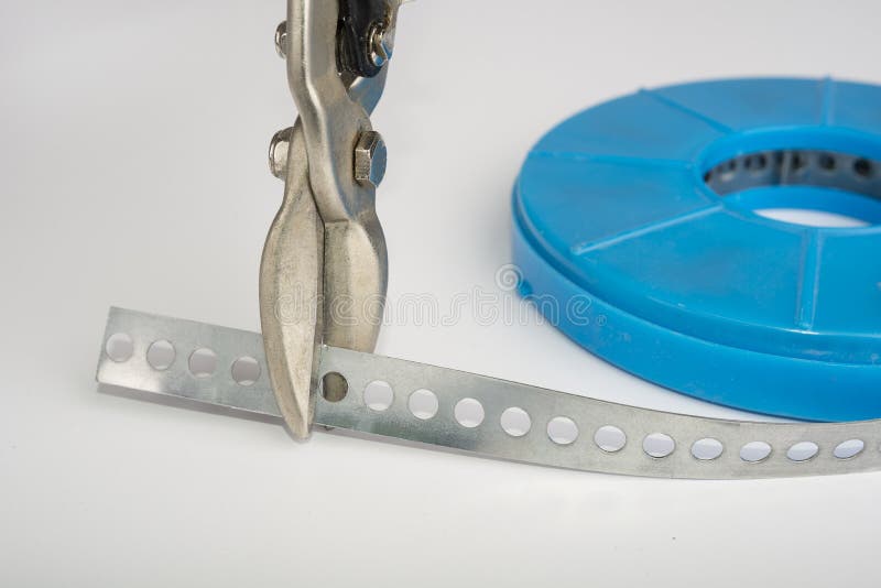 Perforated Galvanized Steel Strip on a White Stock Photo - Image of ...