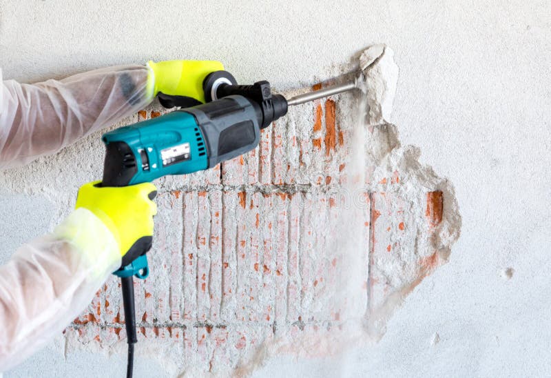 Perforator Work. Removes Plaster from a Brick Wall Stock Photo - Image ...
