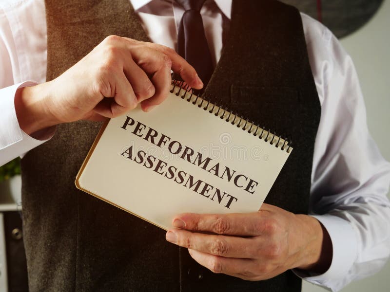 Performance Assessment in the Hands of a Man Stock Photo - Image of ...