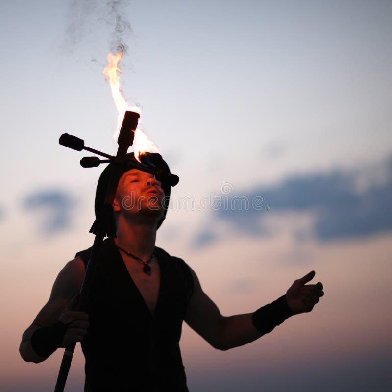 Man fanning fire in grill stock photo. Image of color - 25142742