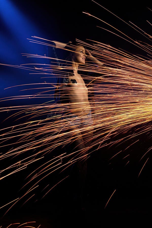 Performer Showcases Dazzling Sparks in Dynamic Dance Routine at Night ...