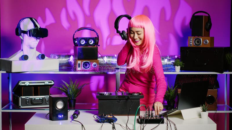 Asian Artist Standing at Dj Table Performing Techno Song Using ...