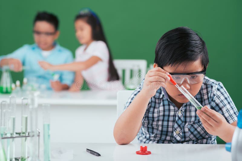 Performing experiment stock image. Image of chemistry - 56185967