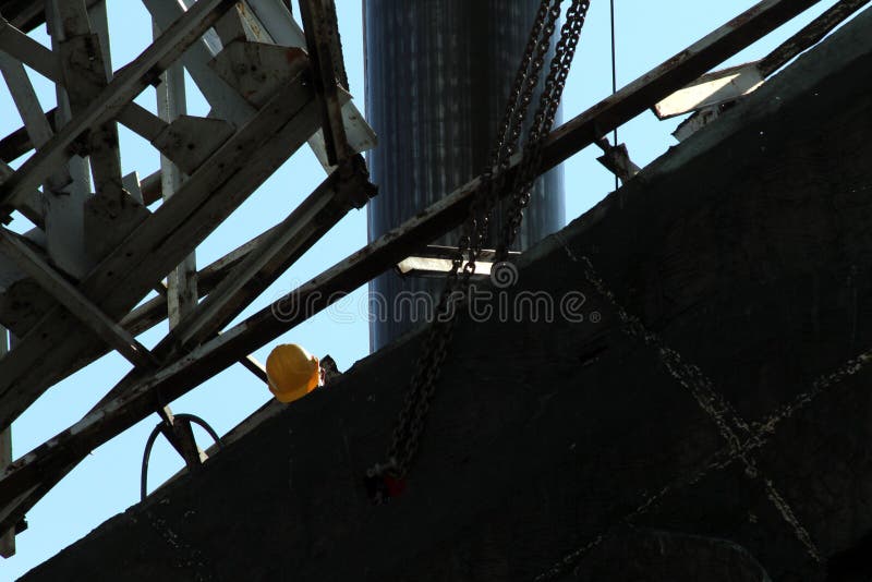 Performing Heavy Construction Work. a Worker Climbs in Height and ...