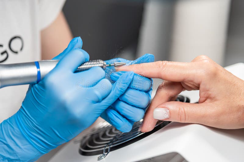 Performing Manicure Work in a Beauty Salon Stock Photo - Image of blue ...