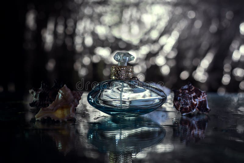 Perfume in Beautiful Blue Bottle Stock Image - Image of cockleshell ...