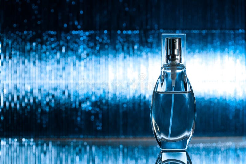 Perfume on blue background stock image. Image of elegant - 29181685