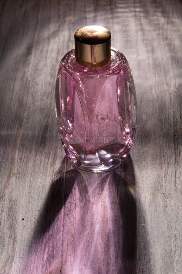 Perfume Bottle and Dramatic Light Stock Photo - Image of essence, aroma ...