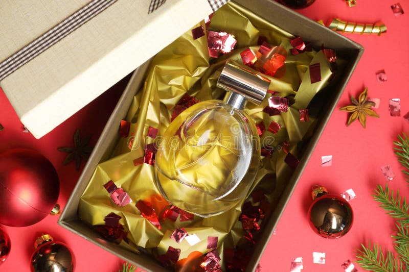Perfume Bottle in Gift Box and Christmas Decor on Red Background, Flat ...