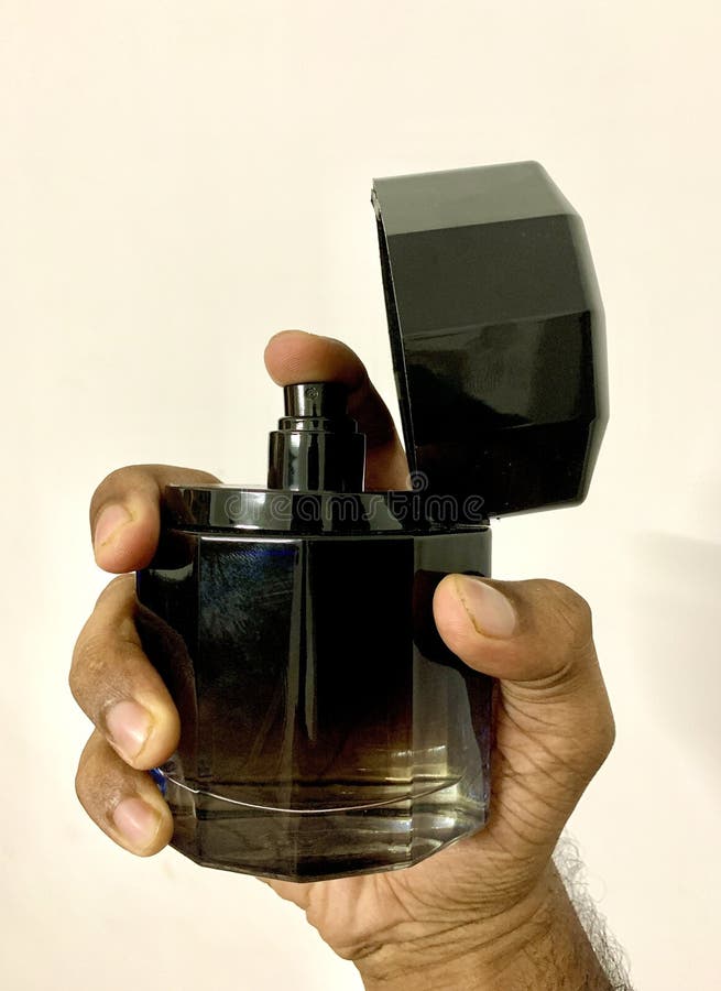 Perfume Bottle Holding in Hand Stock Image - Image of hand, perfume ...
