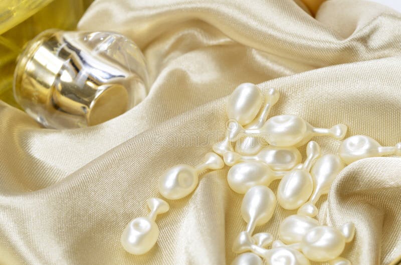Perfume bottle and pearls stock photo. Image of aroma - 19635822