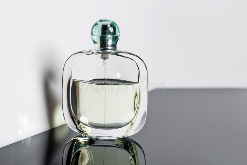 Perfume Bottle with Reflection on White Background. Perfumery ...