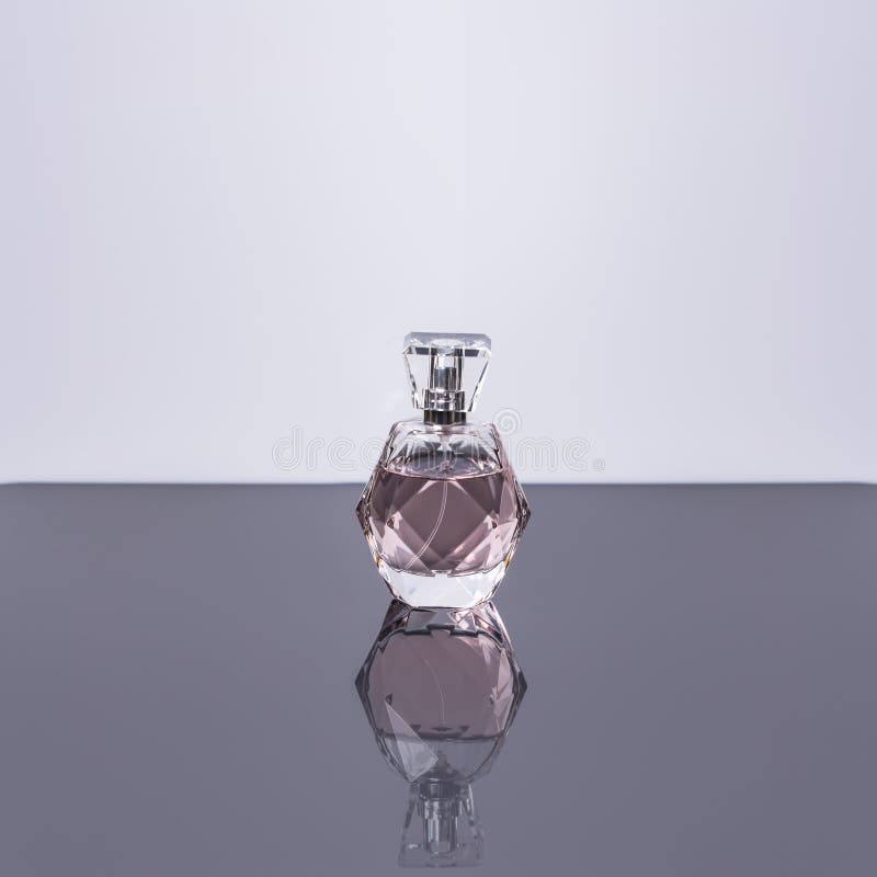 Perfume Bottle with Reflection on White Background. Perfumery ...