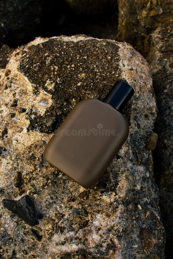 Perfume Bottle on the Rock , Topview Stock Photo - Image of scent ...