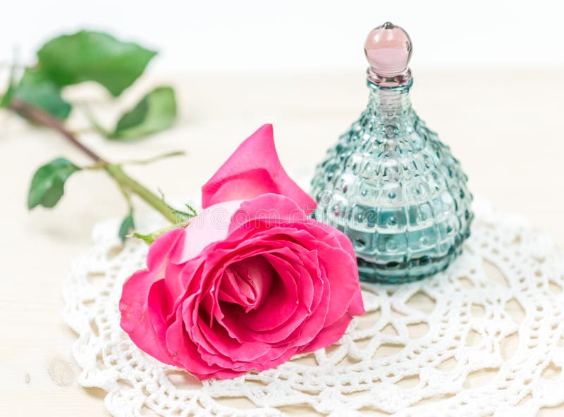 Perfume bottle with roses stock photo. Image of hygiene - 52303356
