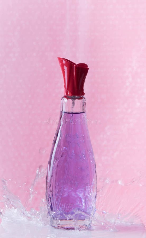 Perfume Bottle Splash on Pink Stock Image - Image of pink, bottle: 46805011
