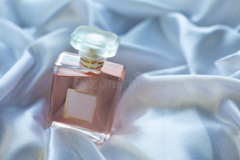 Perfume on white silk stock image. Image of ripple, abstract - 319799861