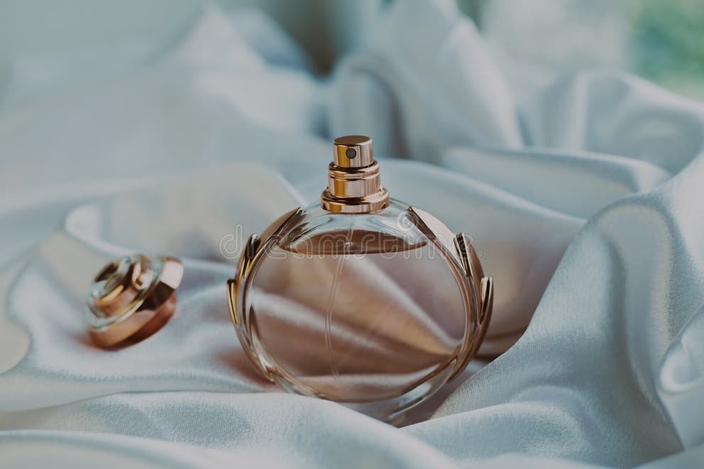 Perfume on white silk stock photo. Image of aroma, liquid - 324308324